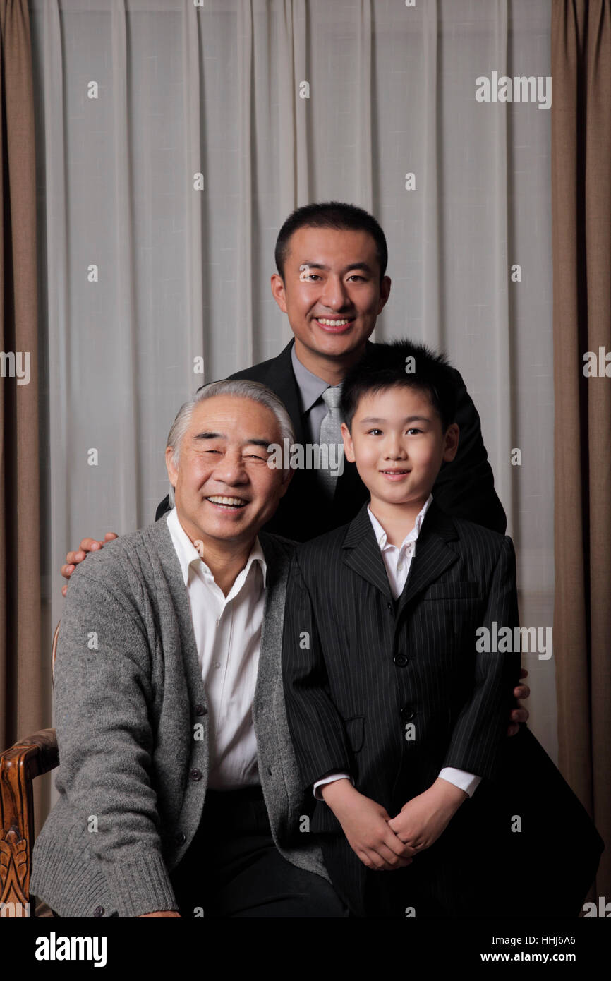 Three generation portrait of grandfather, father and son Stock Photo ...