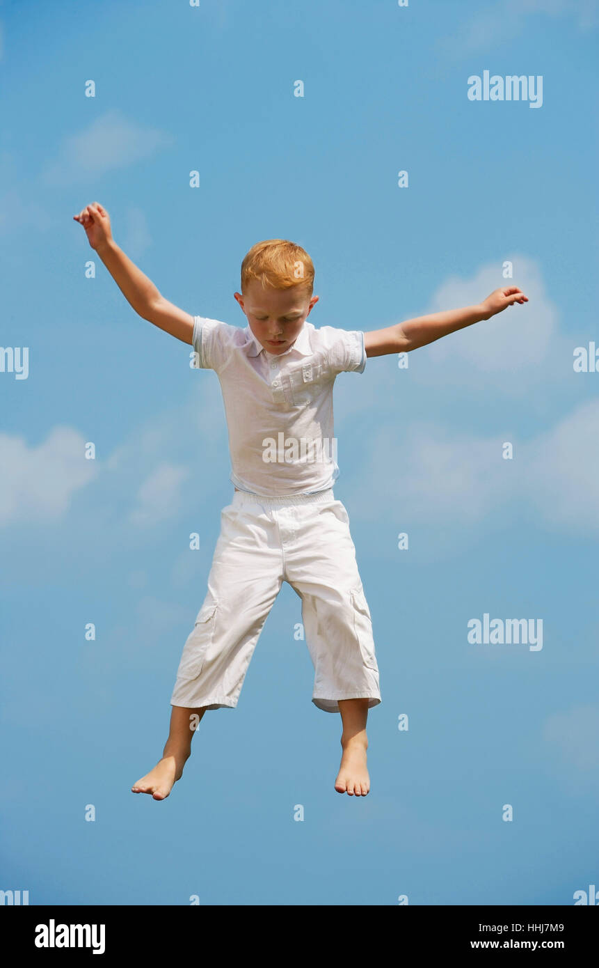 boy jumping in mid-air Stock Photo - Alamy