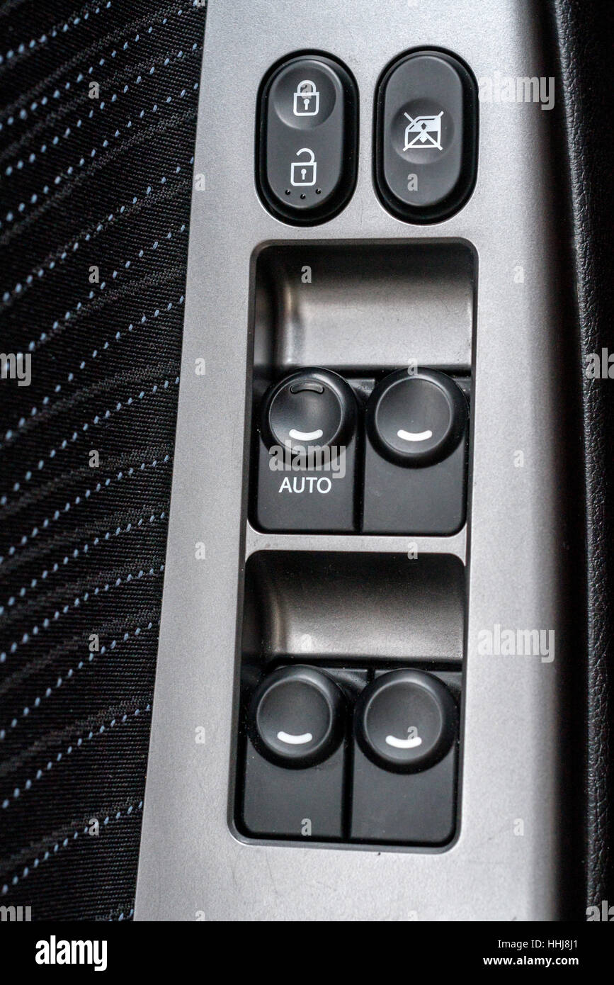 Control panel for electric windows on driver's door, detail of interior ...