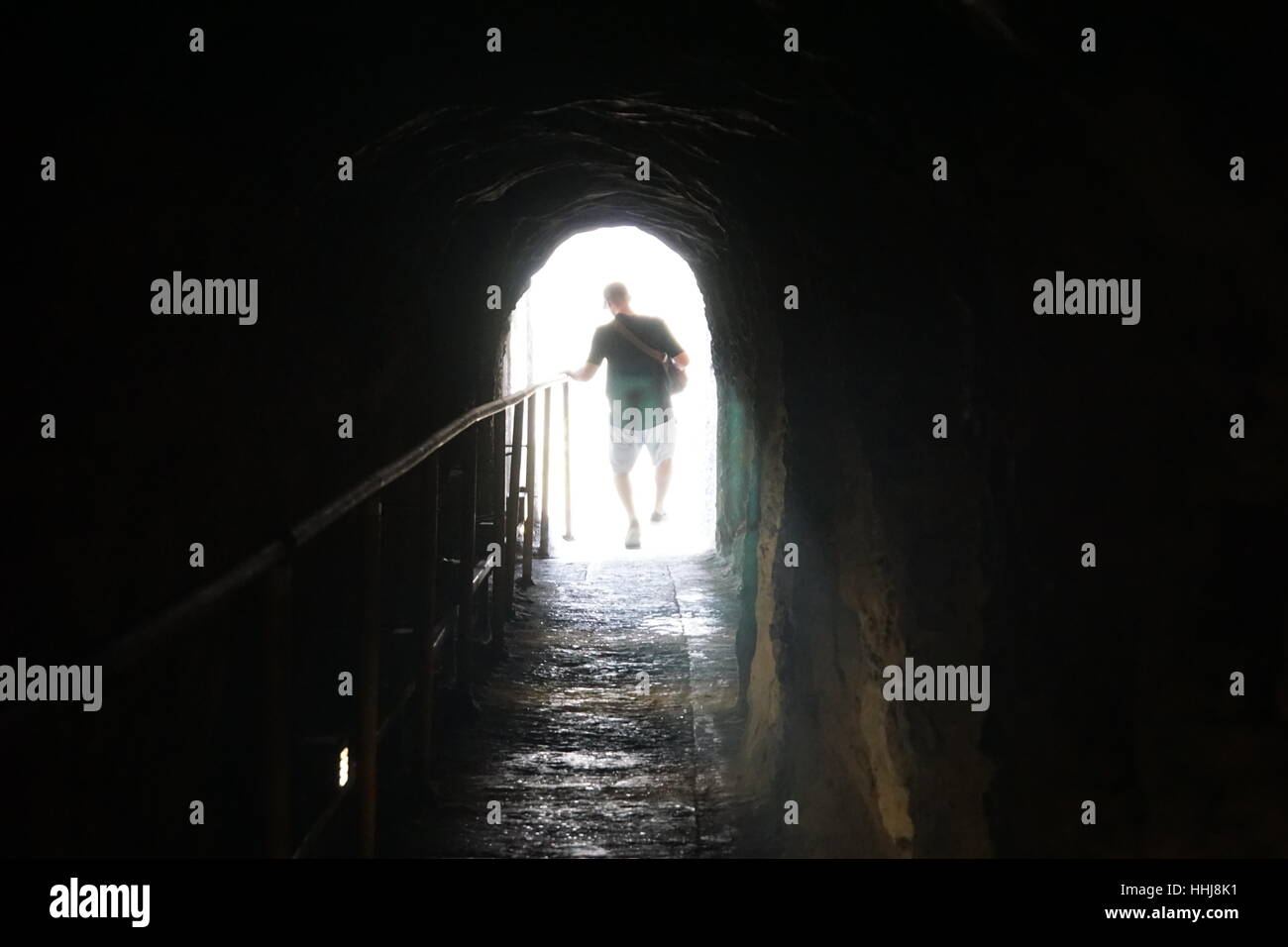 Man Exiting Tunnel - Stepping into the Light at the End of the Tunnel ...