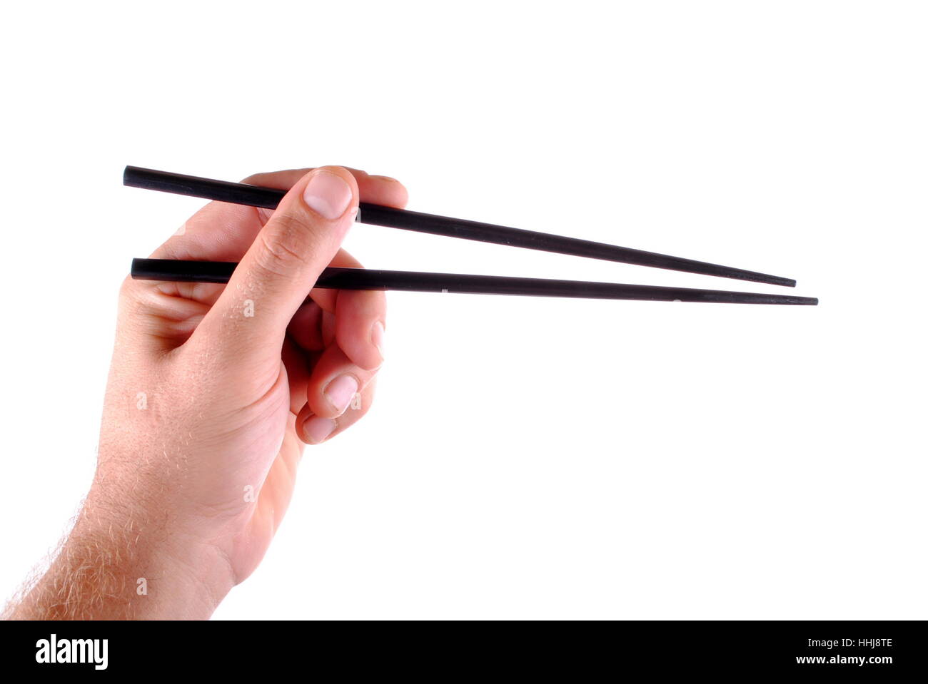 man hand holding black japanese chopsticks Stock Photo - Alamy