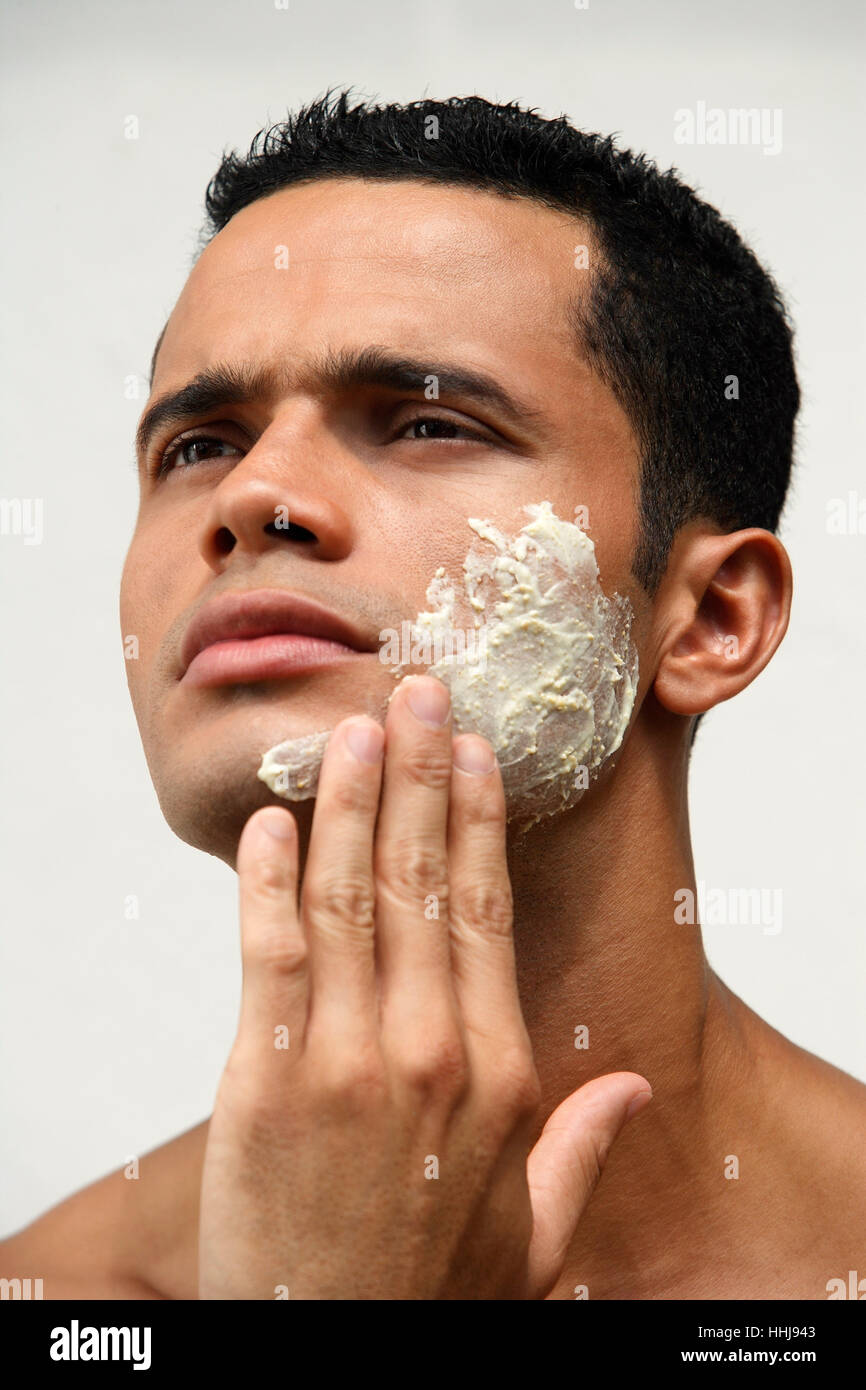 Man applying natural face scrub Stock Photo - Alamy