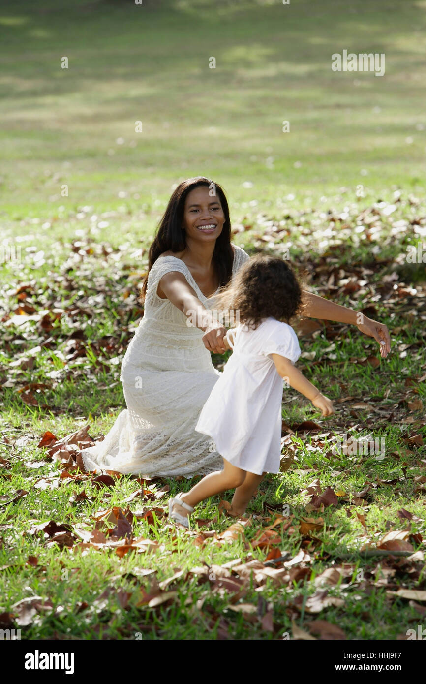 Child running to mother Stock Photo - Alamy