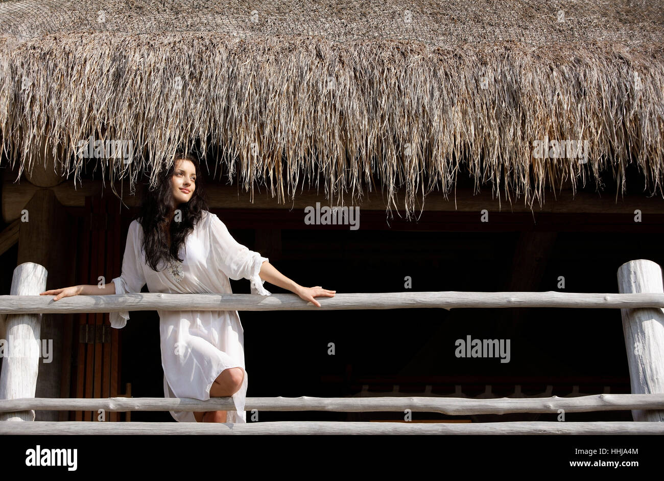 woman looking off balcony Stock Photo - Alamy