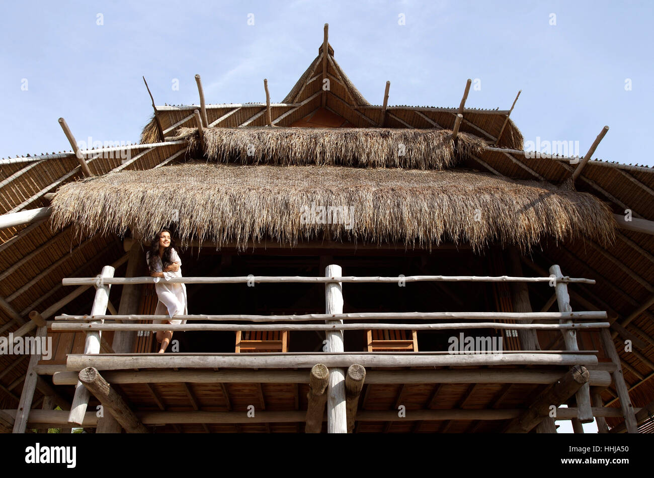 woman looking off balcony Stock Photo - Alamy