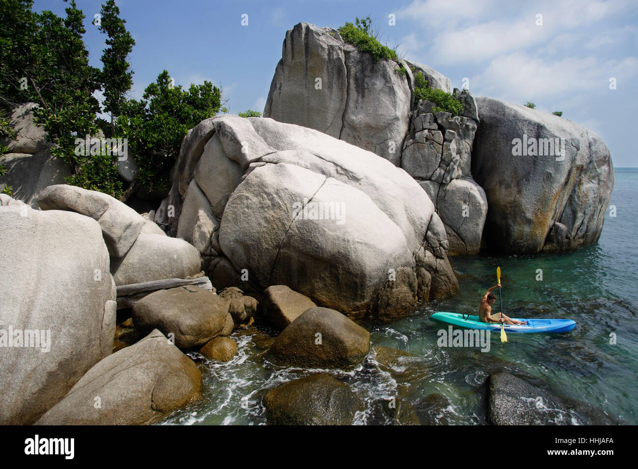 man kayaking near rocks Stock Photo - Alamy