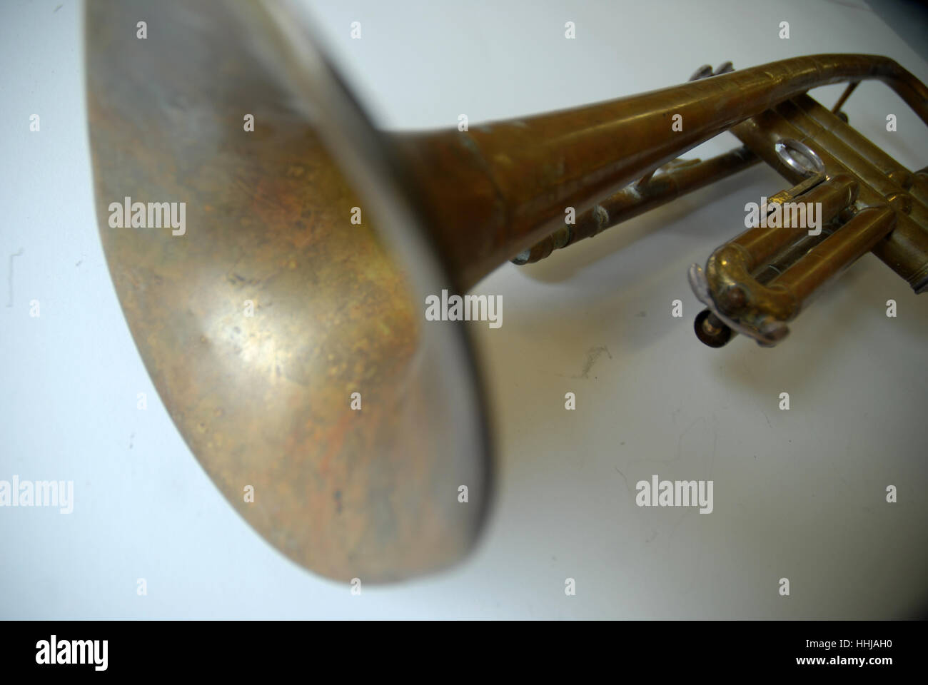 A vintage brass trumpet on a white table top, Portsmouth, Hampshire, UK ...