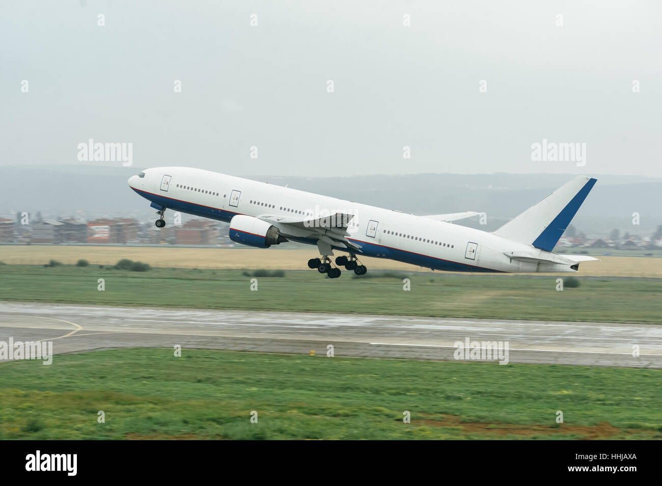 take off into the sky Boeing 777-200ER commercial aircraft Stock Photo ...