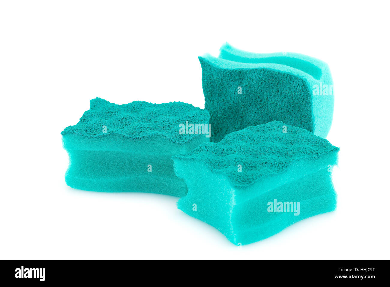 Pile of sponges isolated on white background Stock Photo - Alamy