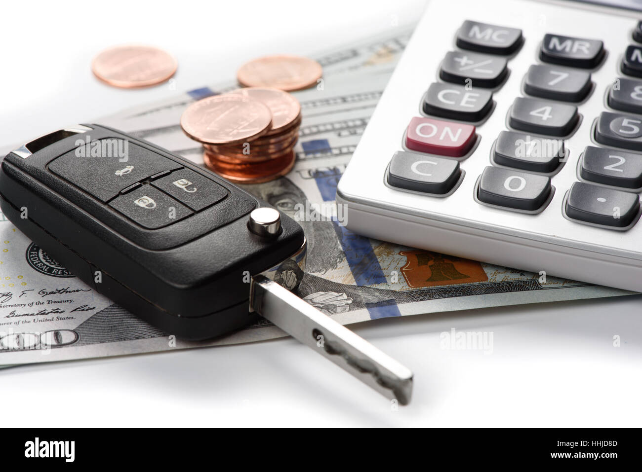 car key with dollars and calculator. US currency Stock Photo - Alamy