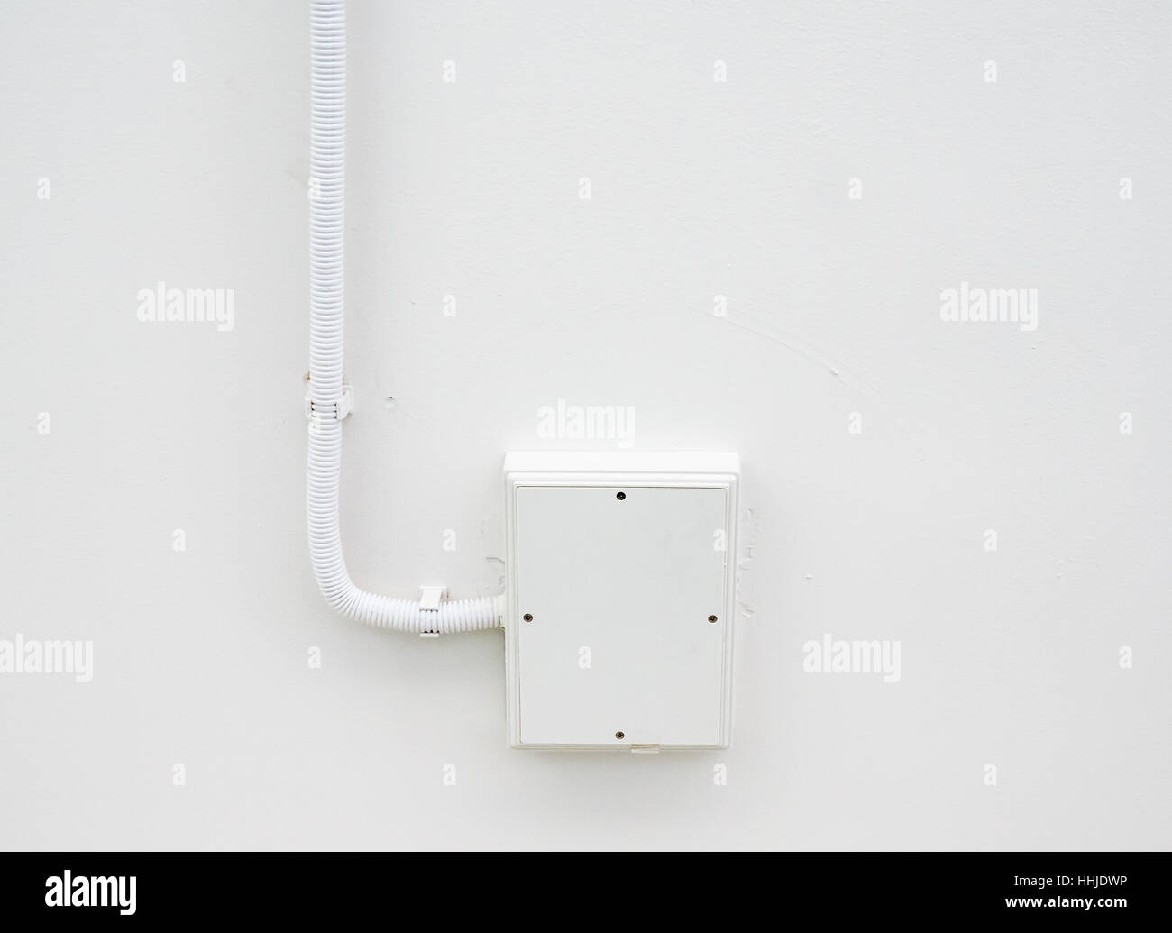 White electrical box with long tube on the ceiling of urban house Stock ...