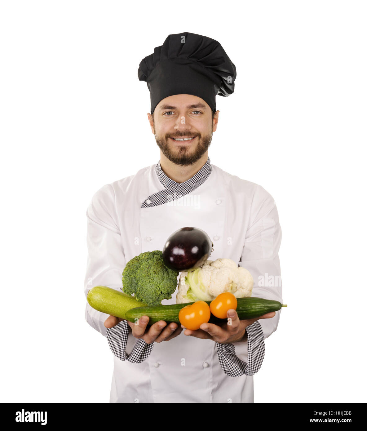 smiling chef with vegetables in hands isolated on white Stock Photo - Alamy