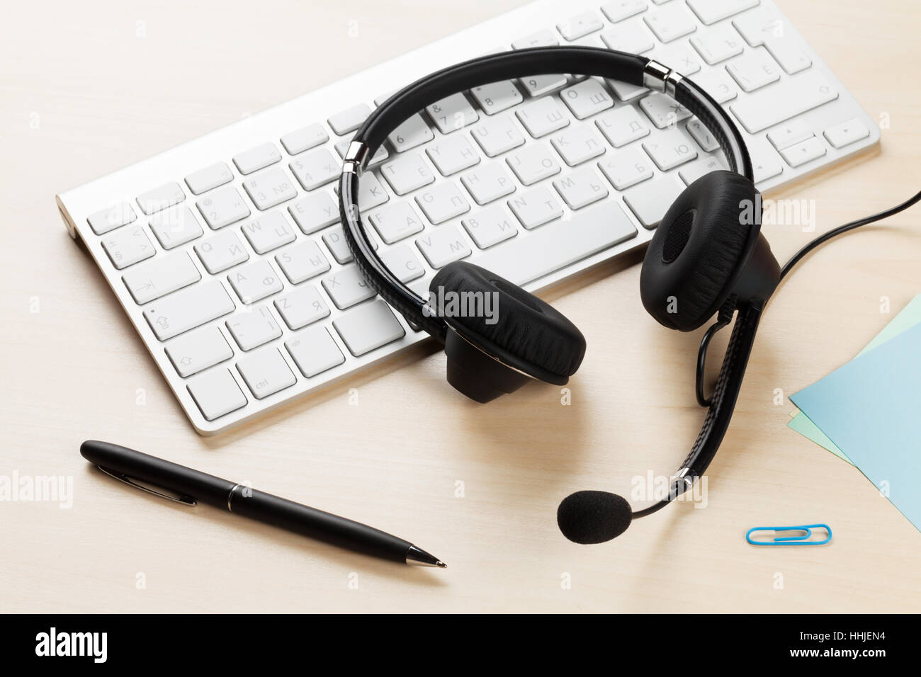 Office desk with headset and pc. Call center support table Stock Photo ...