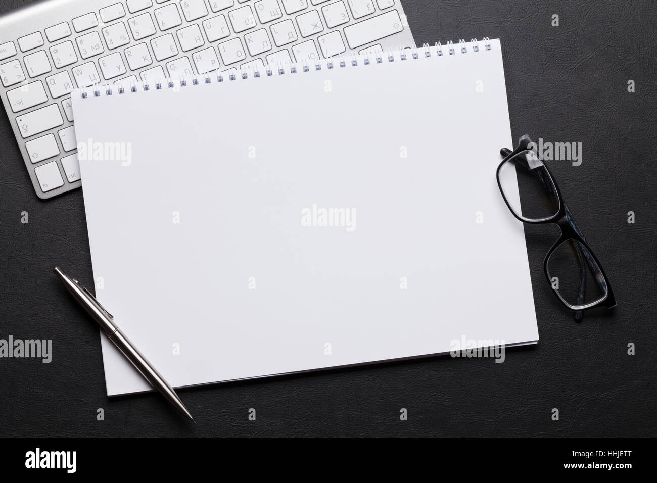 Office leather desk table with pc, notepad, glasses and pen. Top view ...