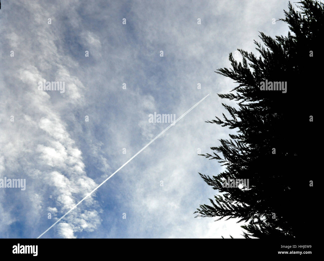 Sky with a plane in diagonal Stock Photo - Alamy
