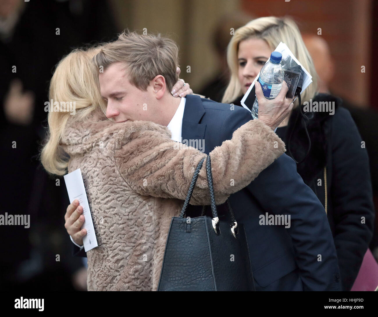 Harry Parfitt hugs his mother Patty Beedon at Woking Crematorium ...