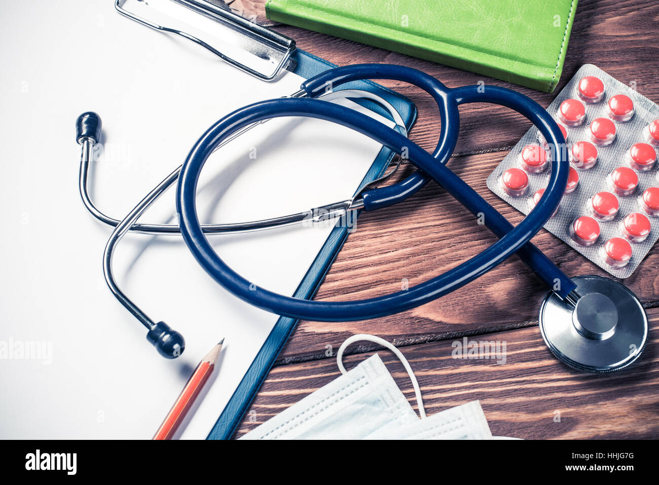 Desk of doctor with medicine things Stock Photo - Alamy