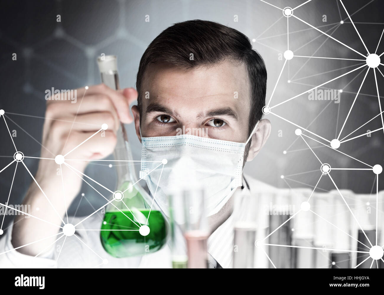 Portrait of concentrated male scientist working with reagents in laboratory Stock Photo - Alamy