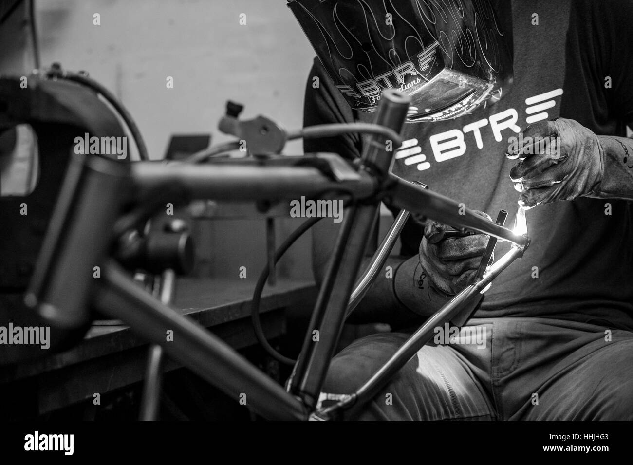 A bespoke steel mountain bike frame is TIG welded in a workshop Stock ...