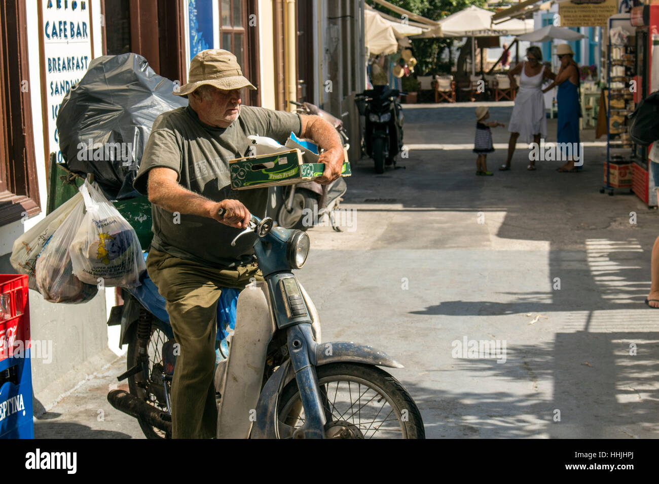 Man carrying things for recycle Stock Photo - Alamy