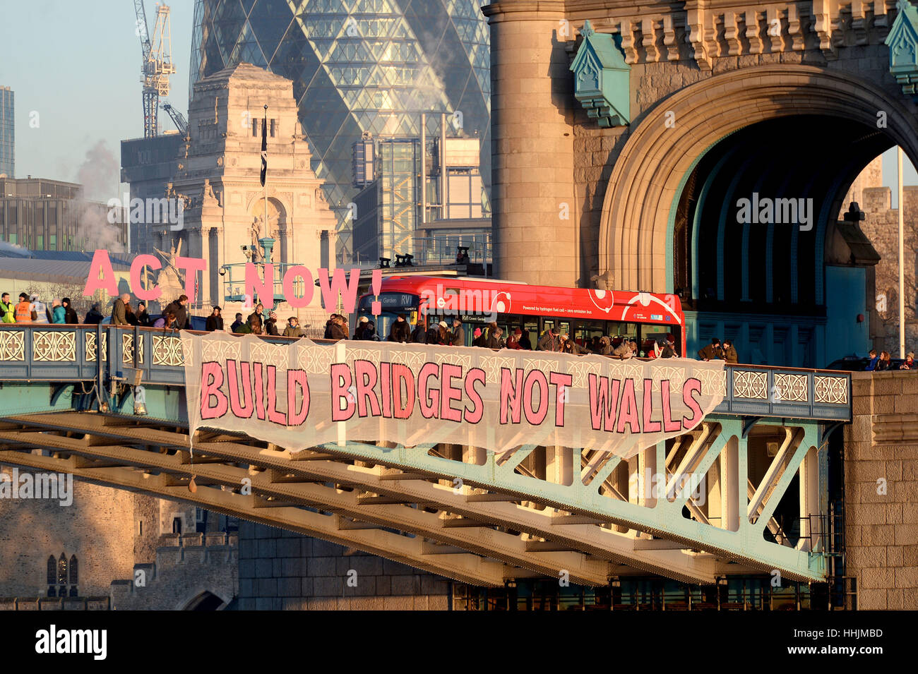 A banner unfurled on Tower Bridge in London as part of the Bridges Not ...