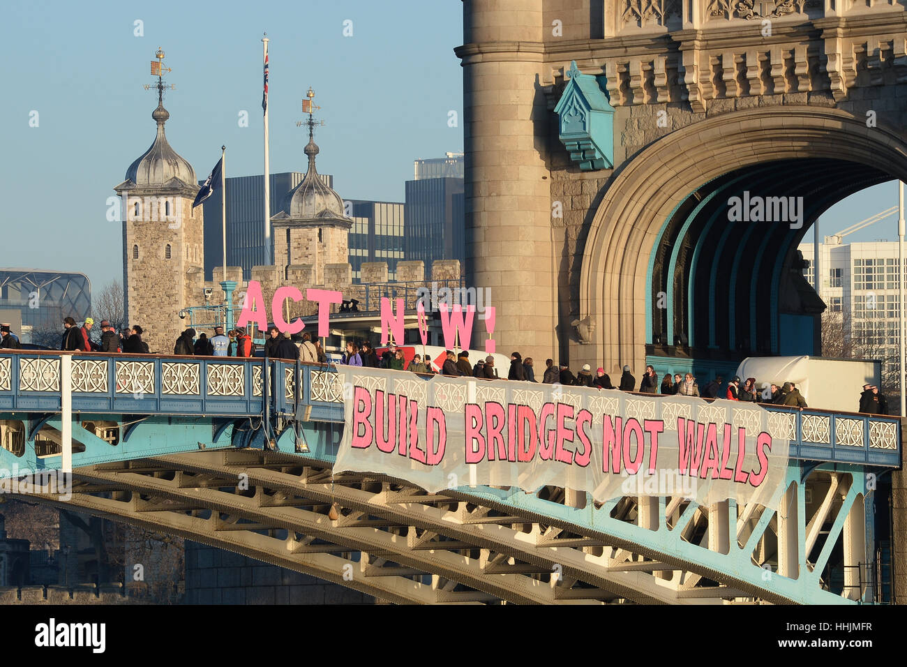 A banner unfurled on Tower Bridge in London as part of the Bridges Not ...