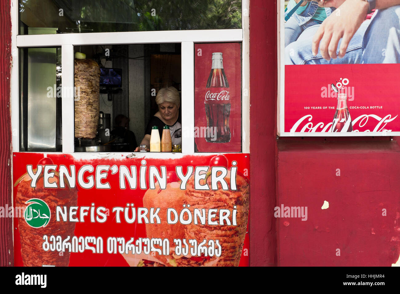 A small shack selling donner kebabs and other fast food in a side ...