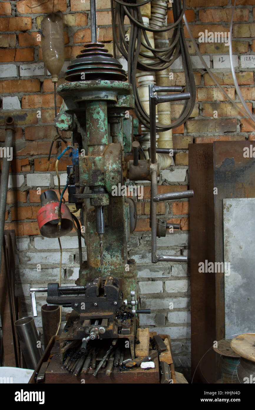 Old and dirty drilling machine in factory Stock Photo - Alamy