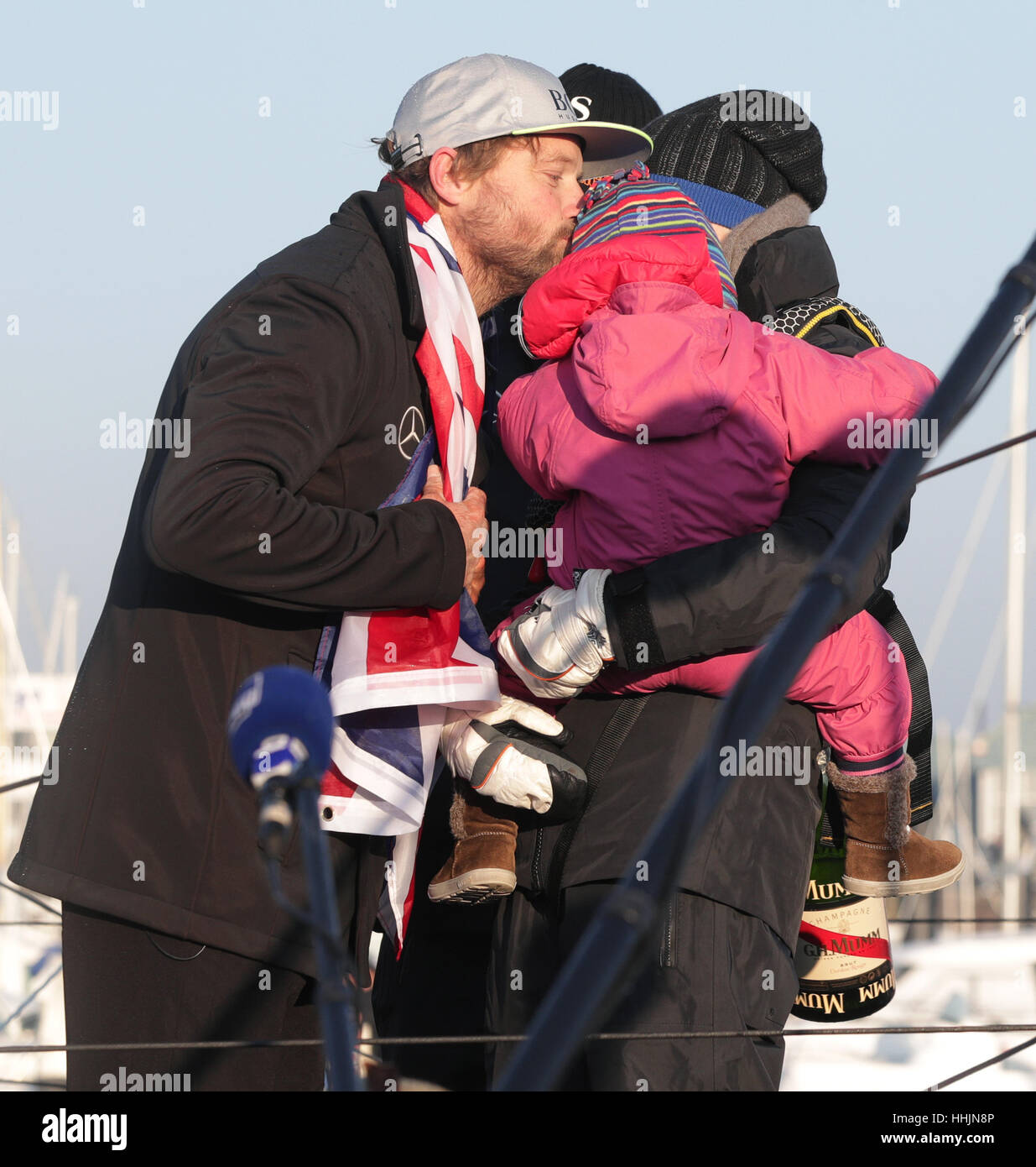 British sailor Alex Thomson kisses his daughter Georgia on deck after ...