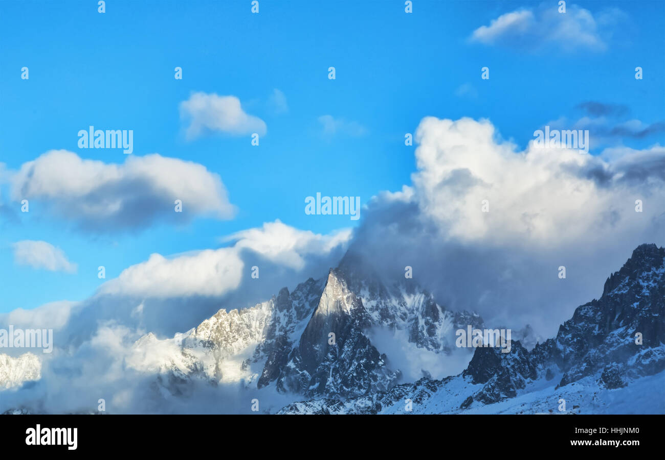 Impressive clouds formation over the high peaks in Alps in Mont Blanc ...