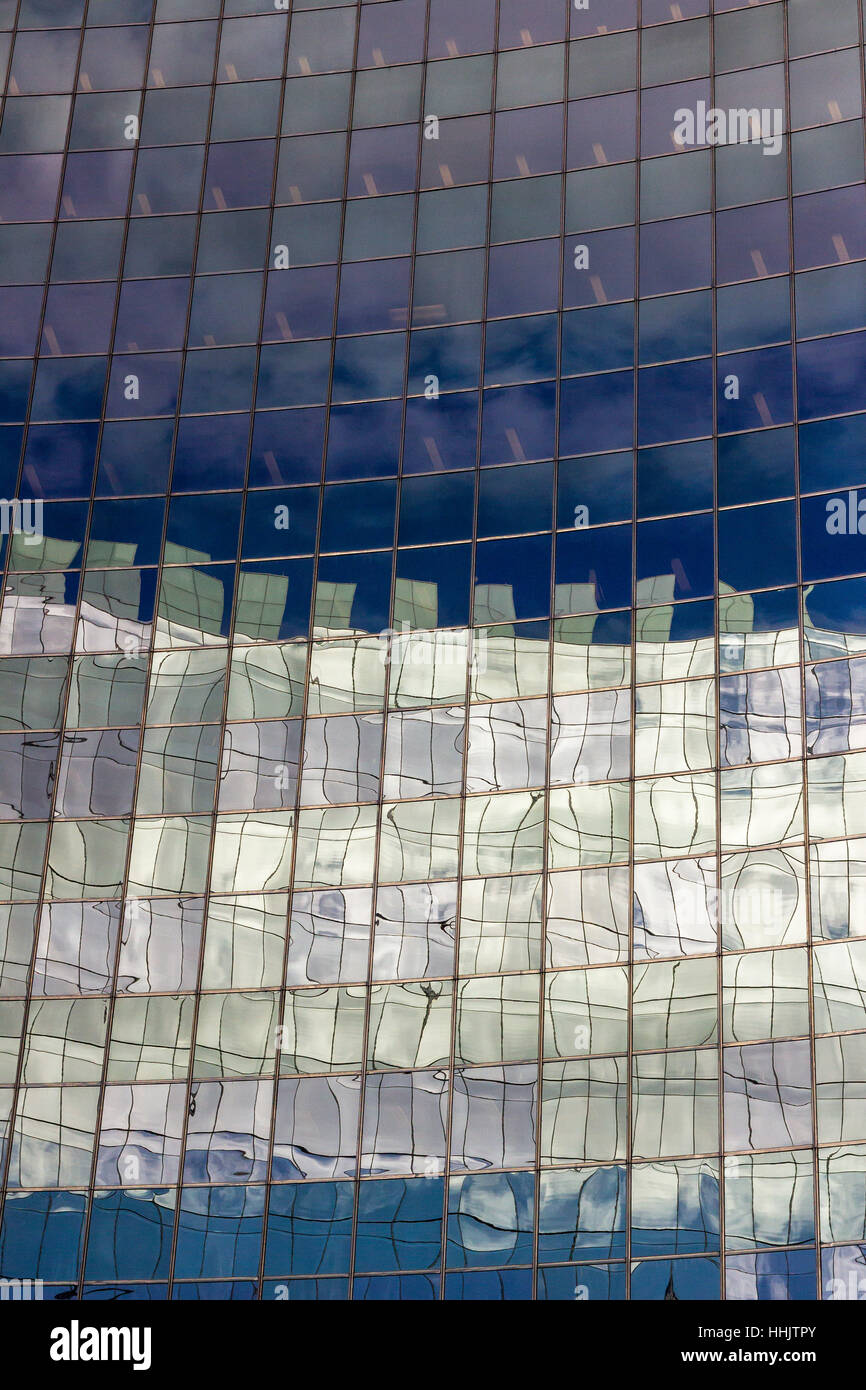 Sky reflecting on high building window glass Stock Photo - Alamy