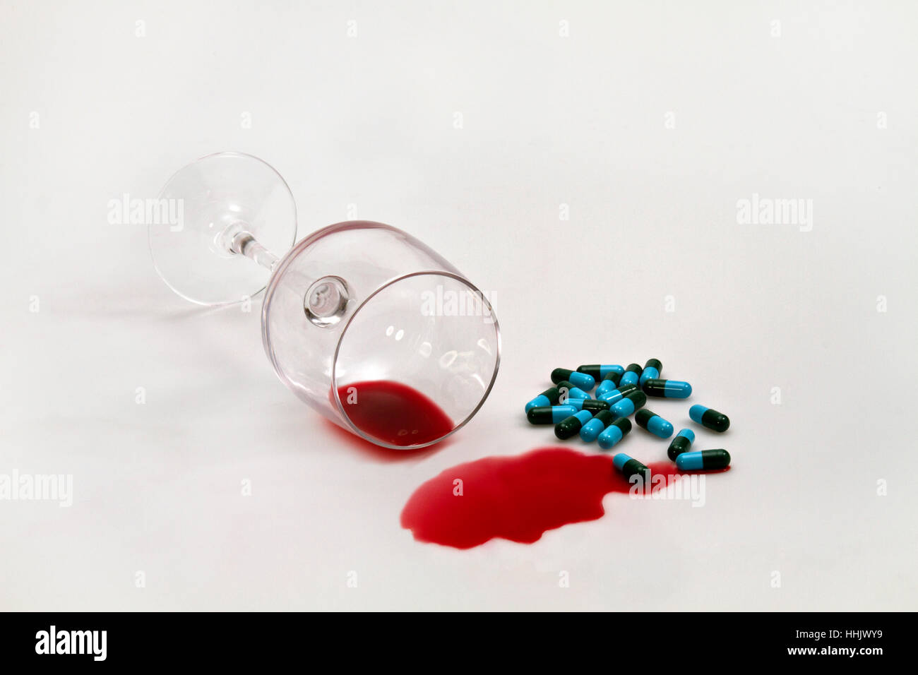 pills and alcohol intake Stock Photo - Alamy