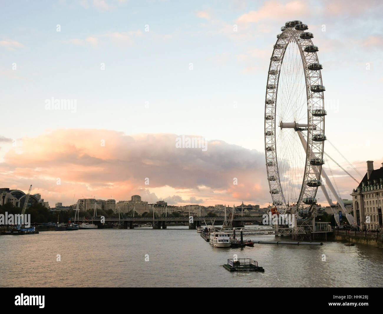 Famous London Eye and Thames river at sunset Stock Photo - Alamy