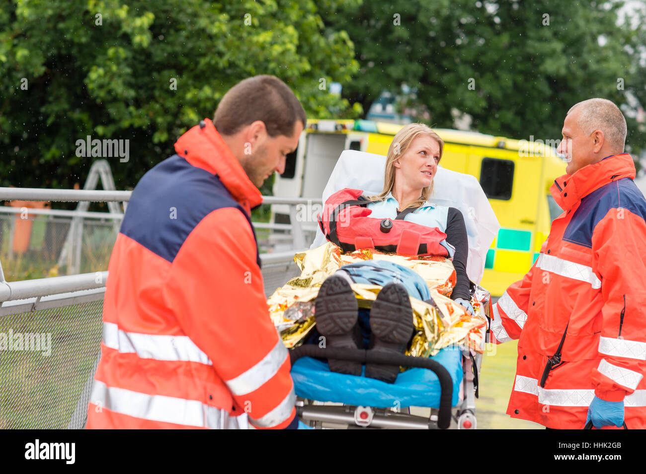 Paramedics talking by ambulance hi-res stock photography and images - Alamy