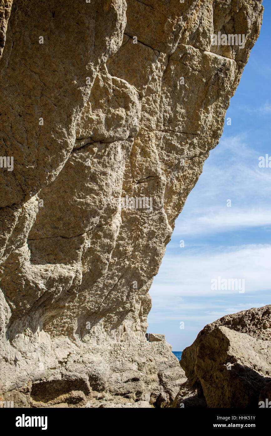 Cliffs of bay against sky Stock Photo - Alamy
