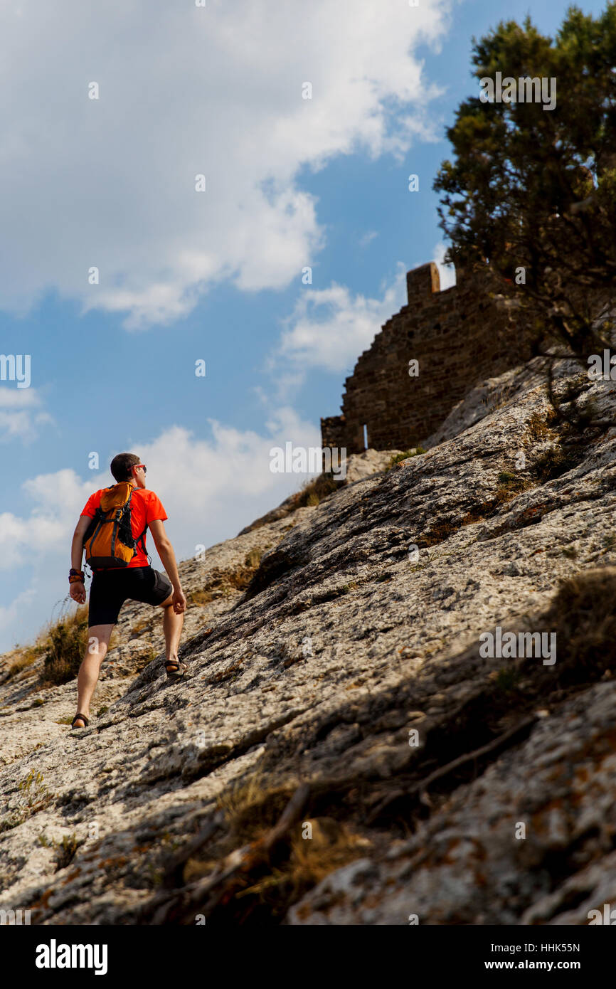 Guy with backpack on mountain Stock Photo - Alamy