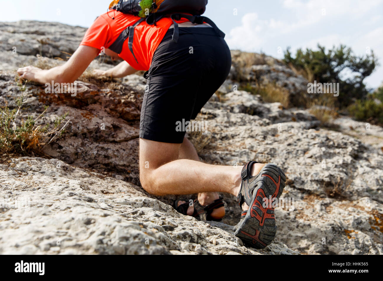Man trying climb on mountain Stock Photo - Alamy