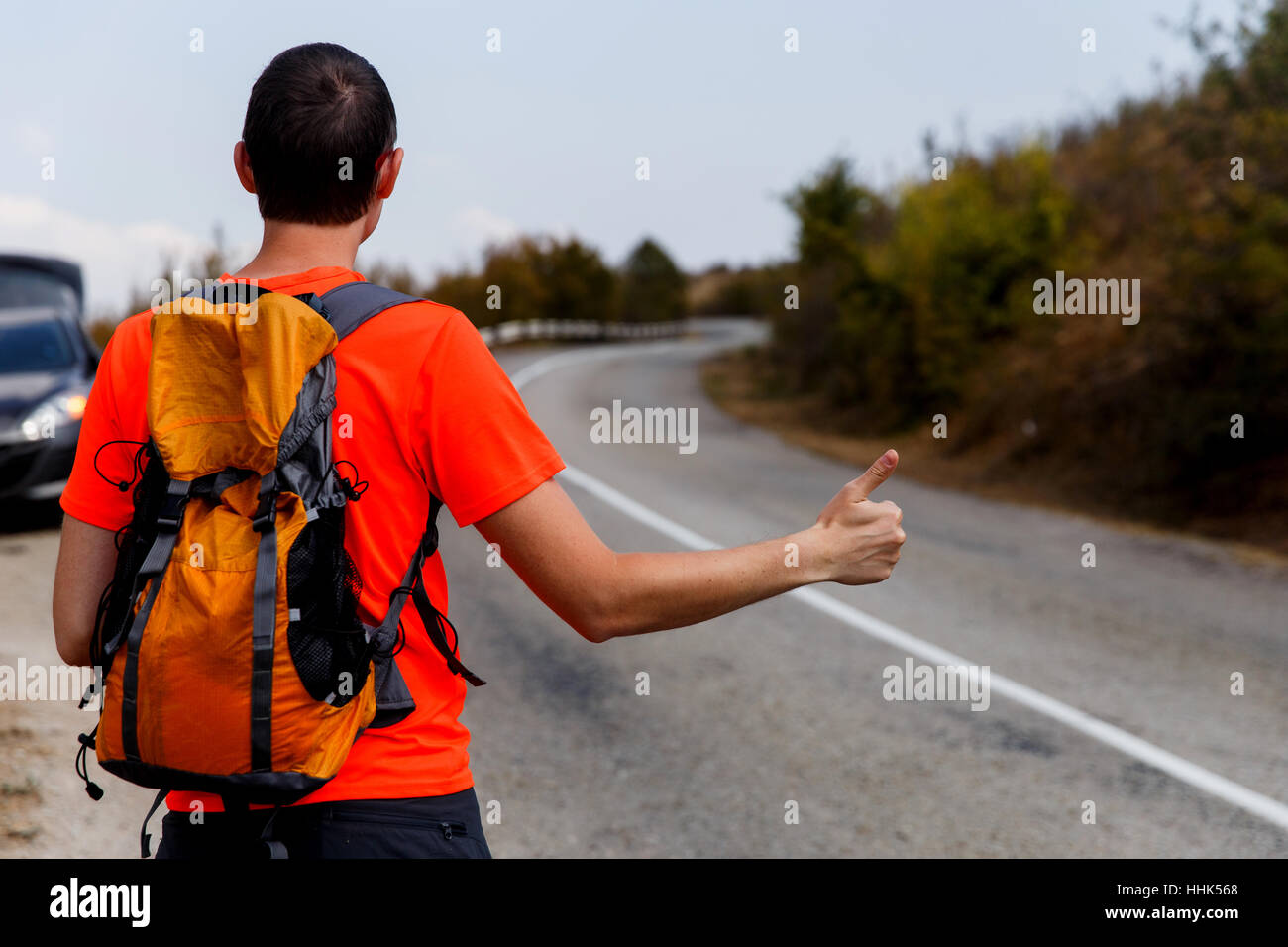 Man stops car on road Stock Photo - Alamy