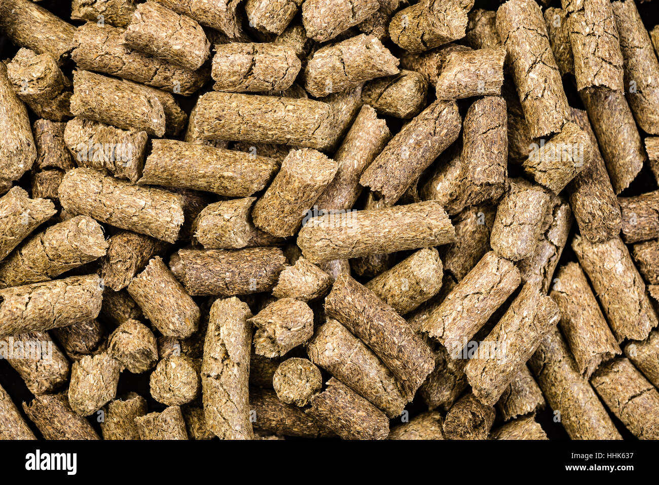 granulated animal food background texture isolated on black Stock Photo ...