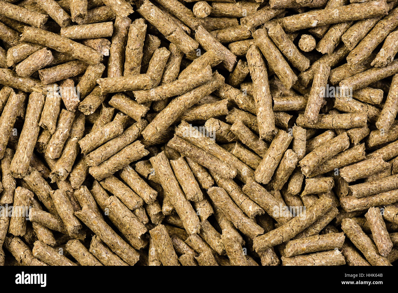 granulated animal food background texture isolated on black Stock Photo ...