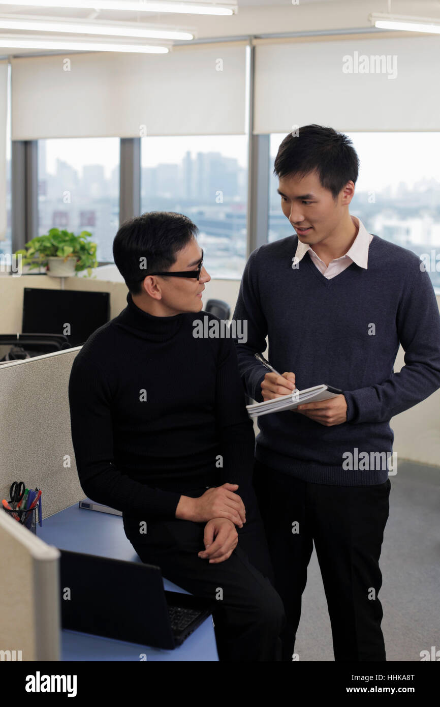 Two men working together in office Stock Photo - Alamy