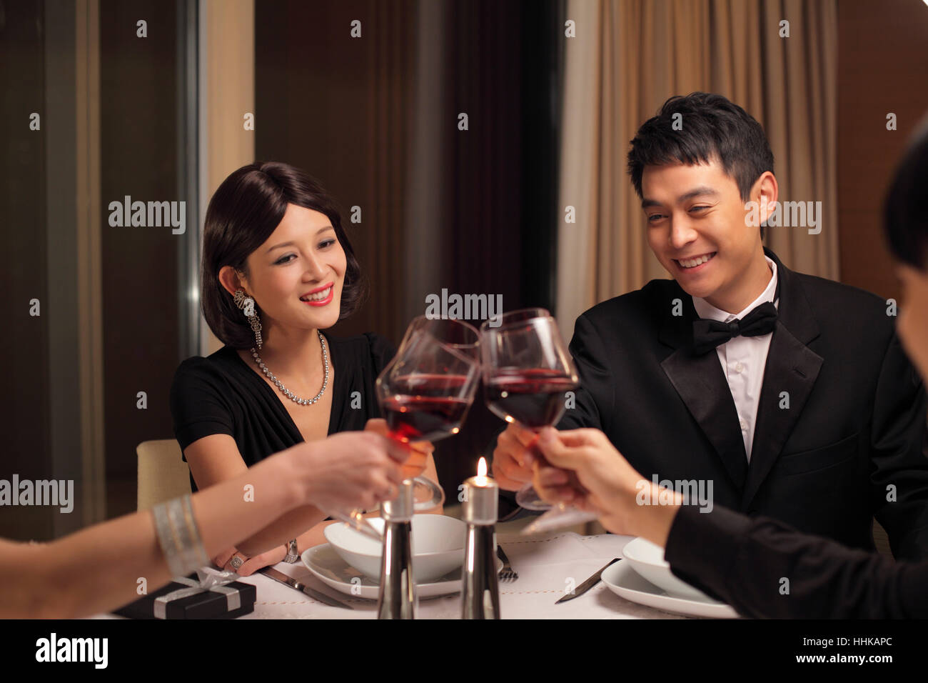 People toasting during a dinner party Stock Photo - Alamy