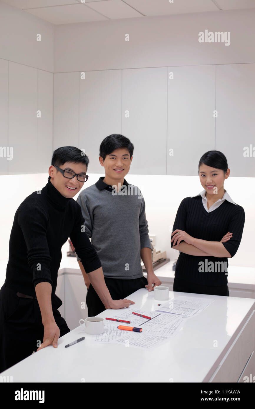 Three people working together in modern office Stock Photo - Alamy