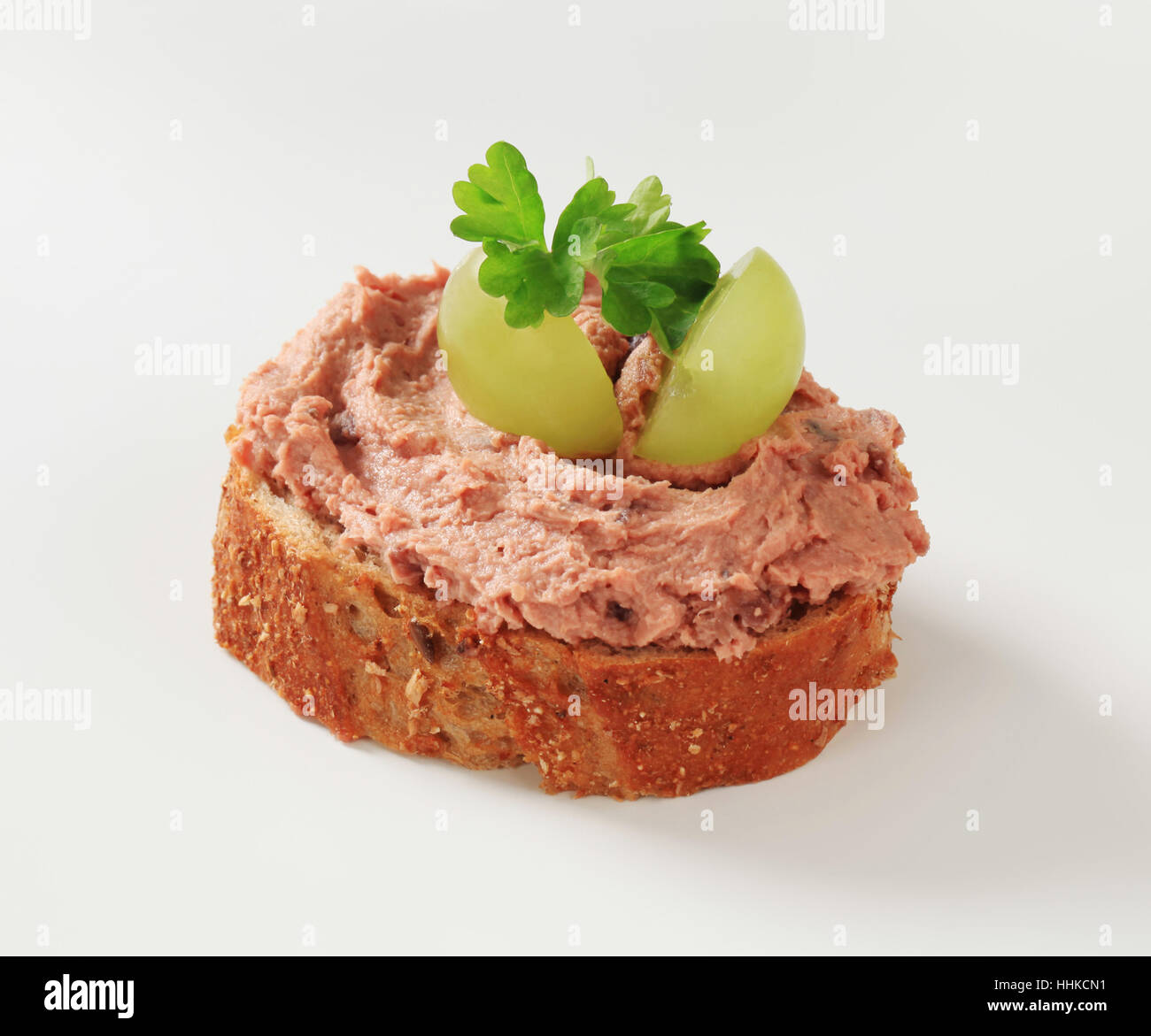 Slice of bread roll and liver pate Stock Photo - Alamy