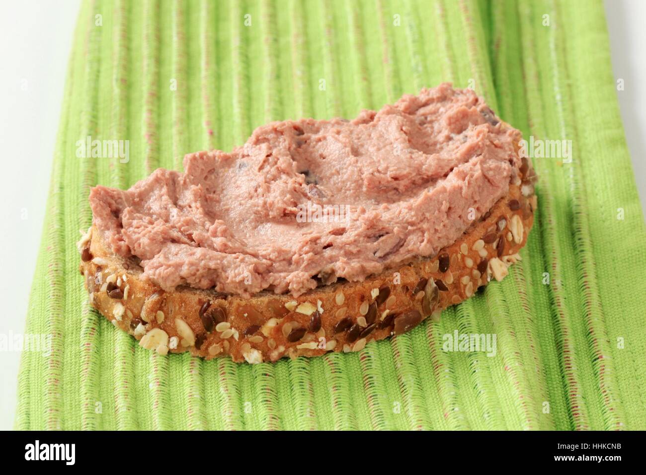 Slice of bread roll and liver pate Stock Photo - Alamy