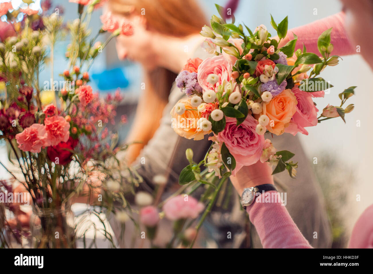 Workshop florist, making bouquets and flower arrangements. Woman ...