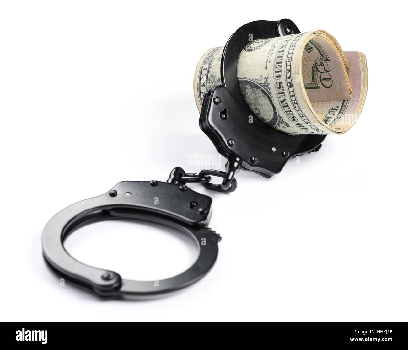 Money and handcuffs isolated on white background Stock Photo - Alamy