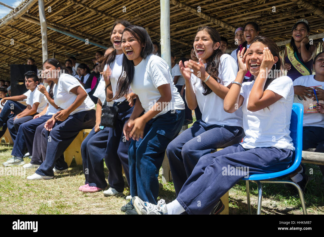 Students from the school, shout and cheer their team from the stands ...