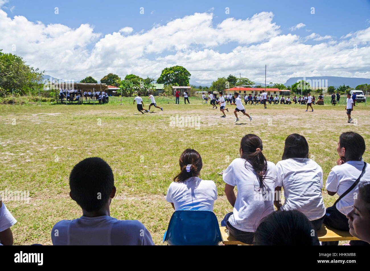 Students from the school, shout and cheer their team from the stands ...