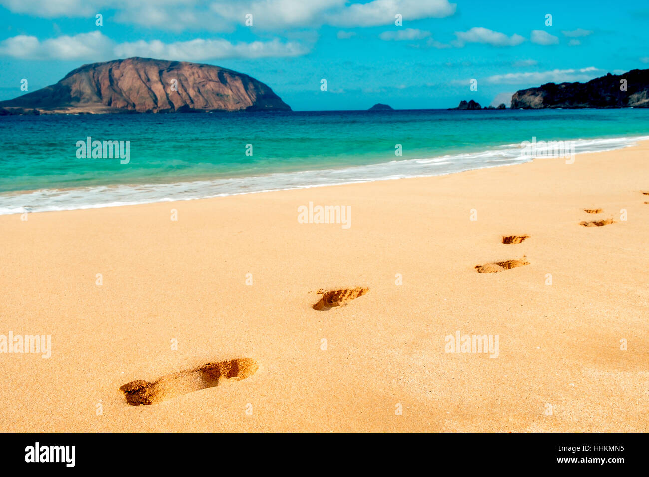 some footprints in the characteristic white sand of Playa de la Conchas ...